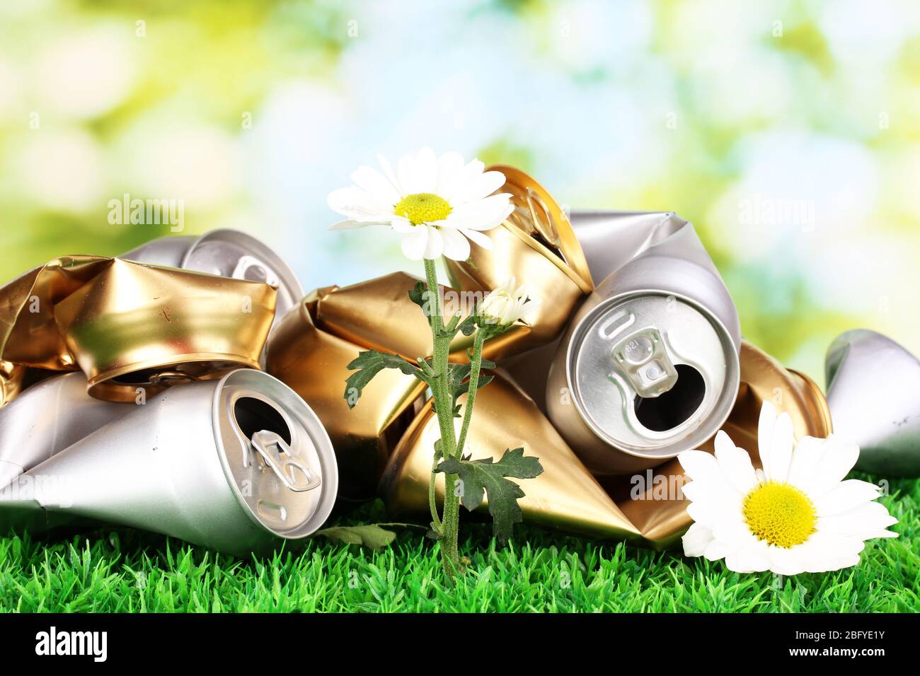 Garbage with growing flower. Environmental conservation concept Stock ...