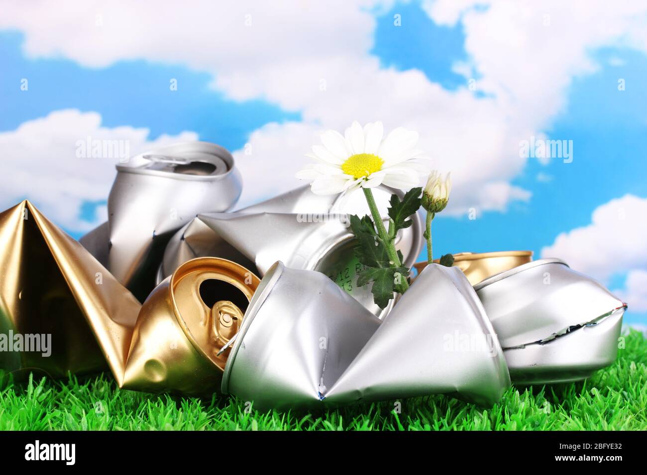 Garbage with growing flower. Environmental conservation concept Stock ...