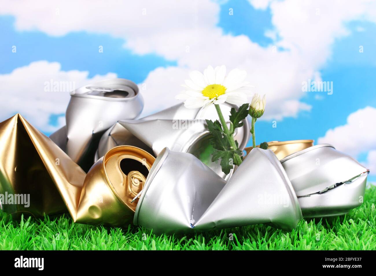 Garbage with growing flower. Environmental conservation concept Stock ...