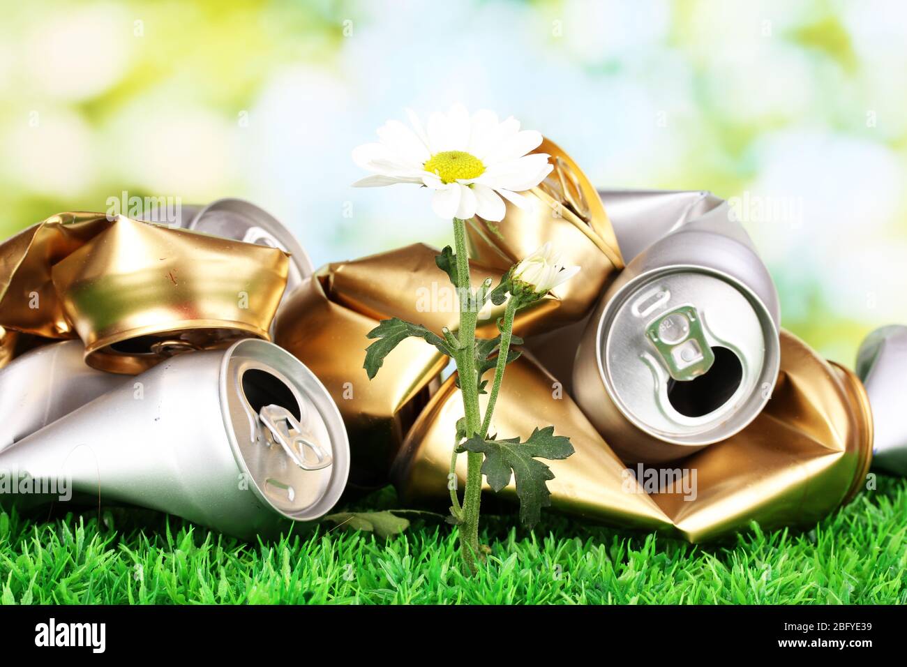 Garbage with growing flower. Environmental conservation concept Stock ...