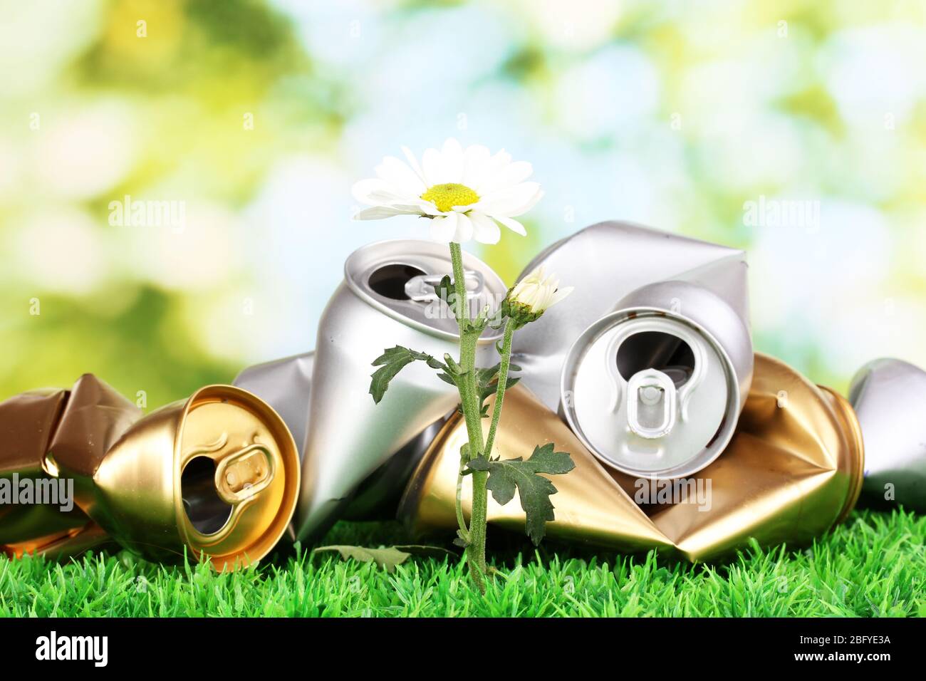 Garbage with growing flower. Environmental conservation concept Stock ...