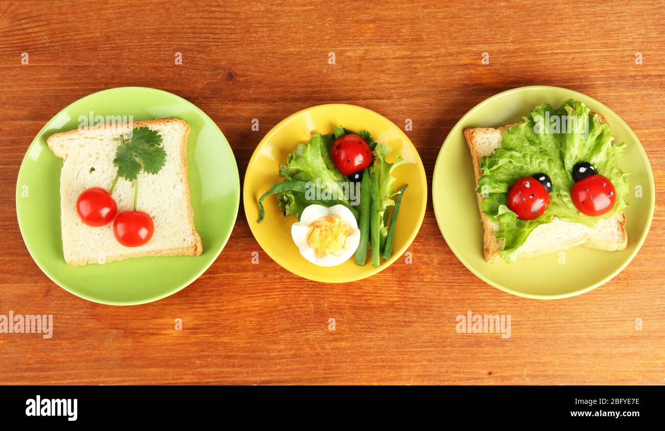 fun food for kids on wooden background Stock Photo - Alamy