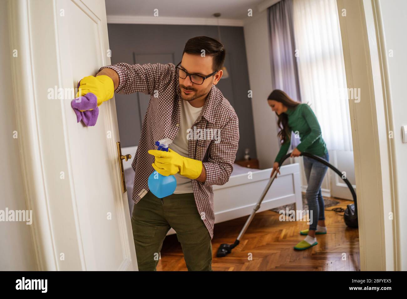Couple cleaning together hi-res stock photography and images - Alamy