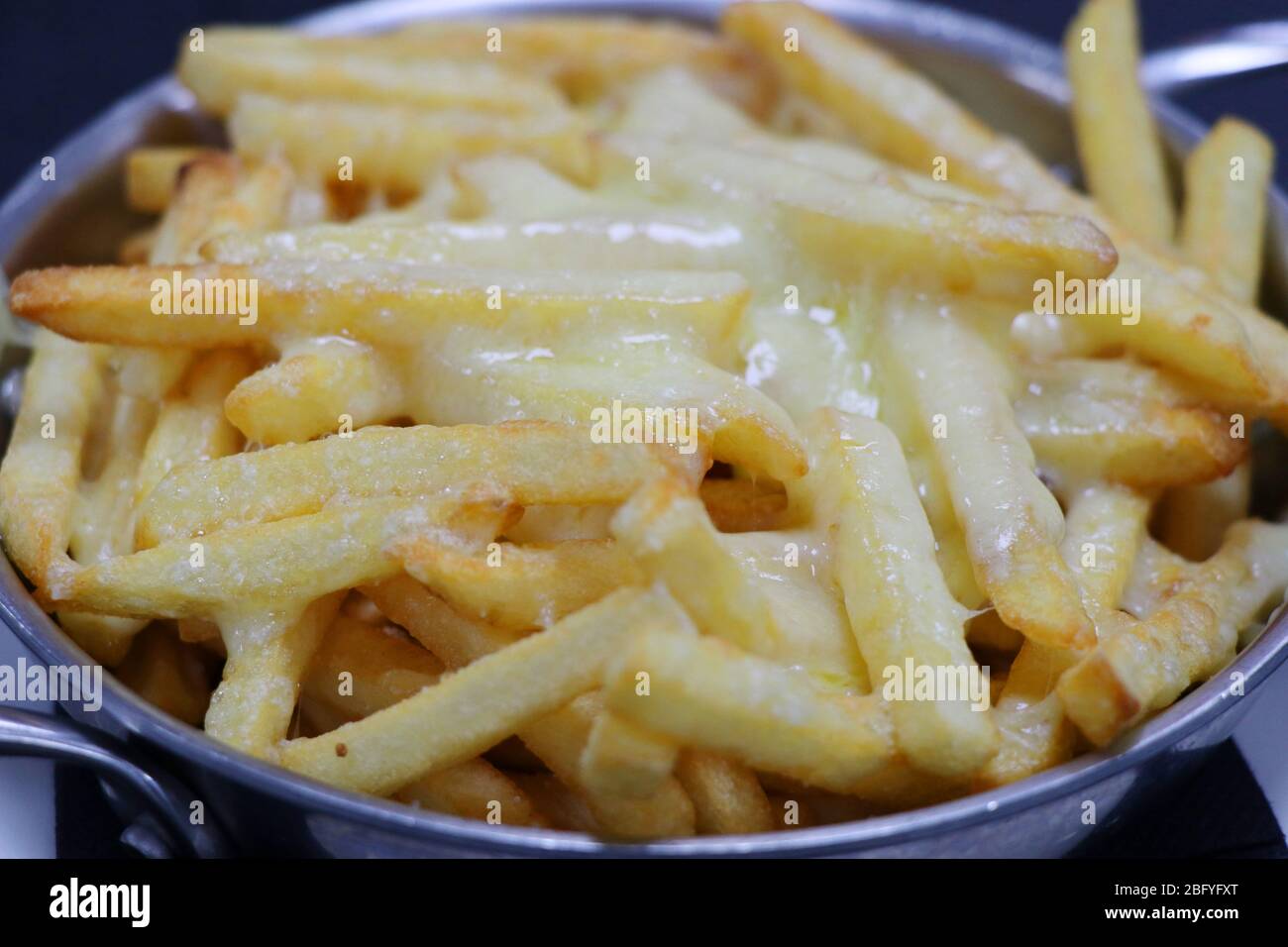 cheesy french fries Stock Photo - Alamy