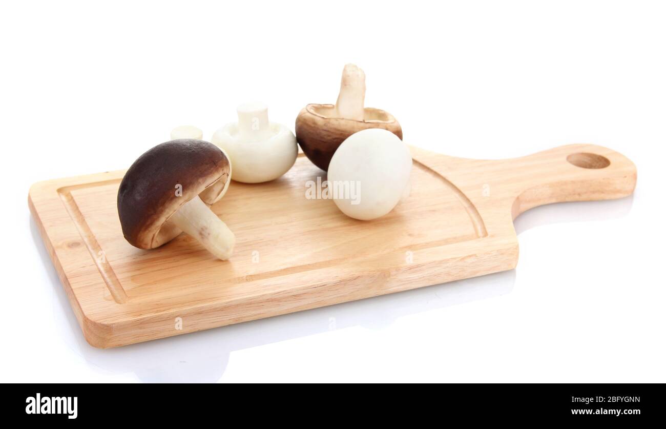 Cutting mushrooms on wooden board Cut Out Stock Images & Pictures - Alamy