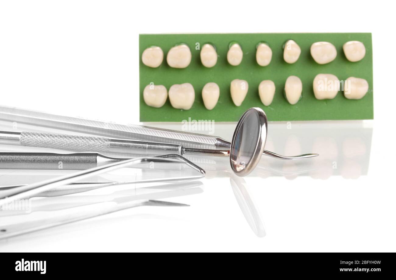 denture with dental tools isolated on white Stock Photo - Alamy