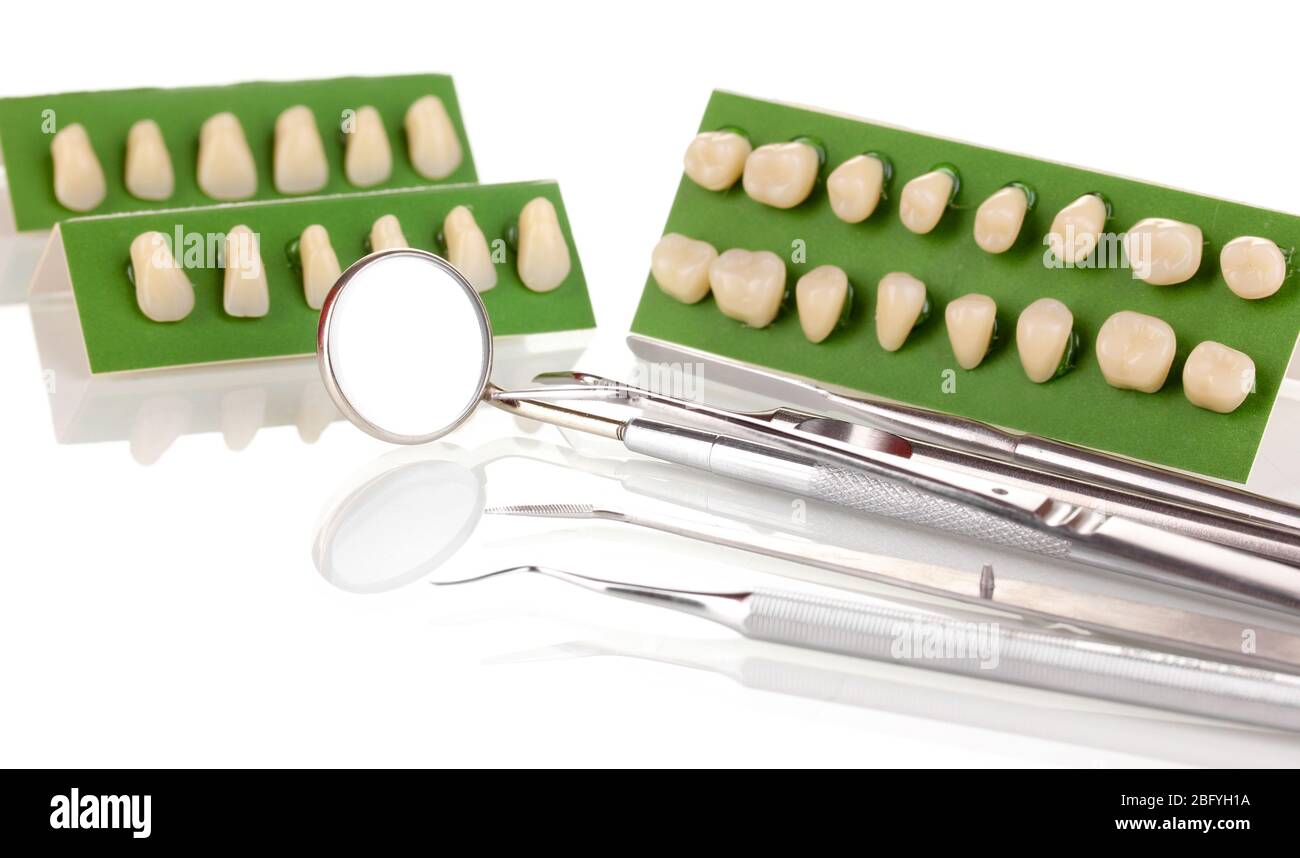 denture with dental tools isolated on white Stock Photo - Alamy