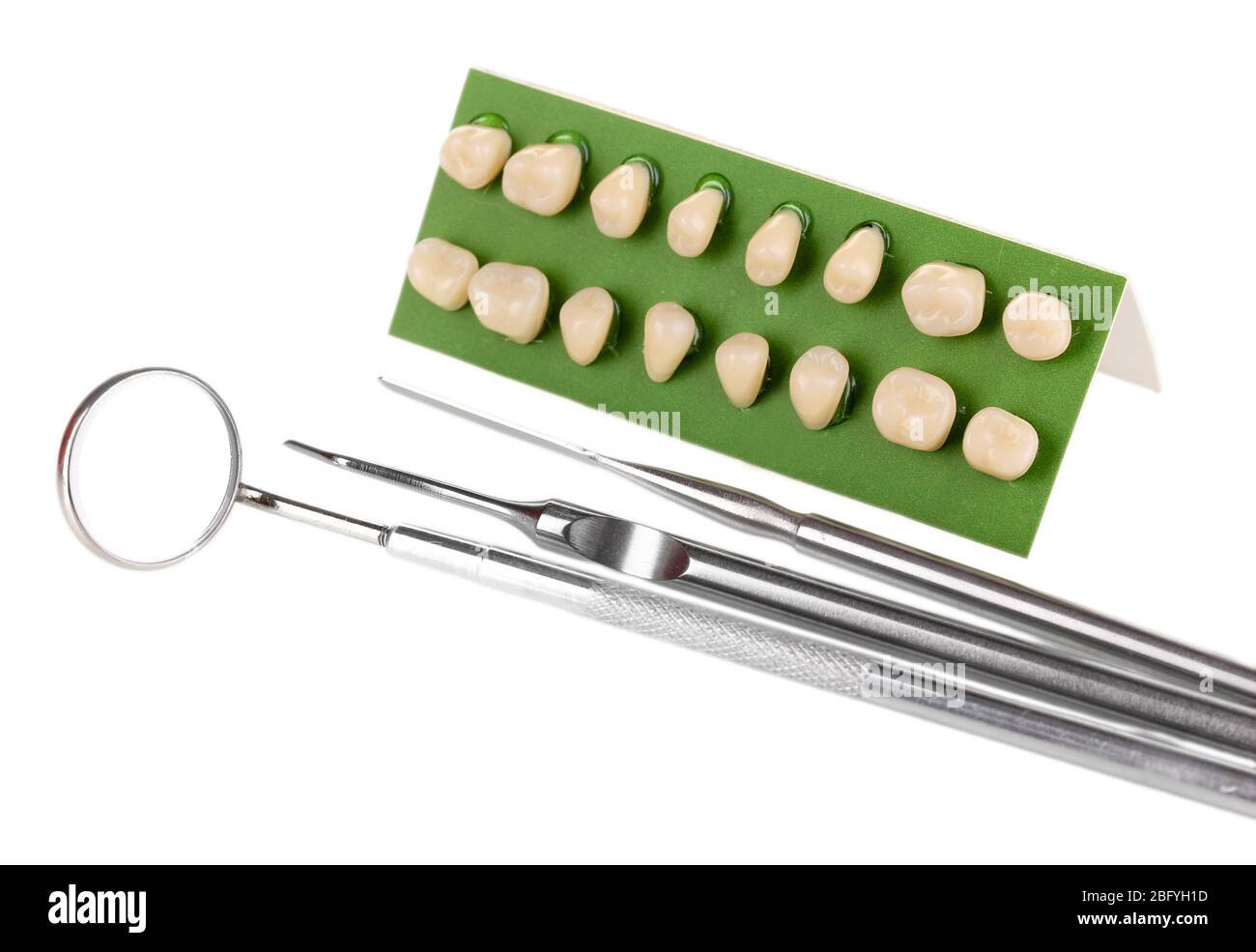 denture with dental tools isolated on white Stock Photo - Alamy