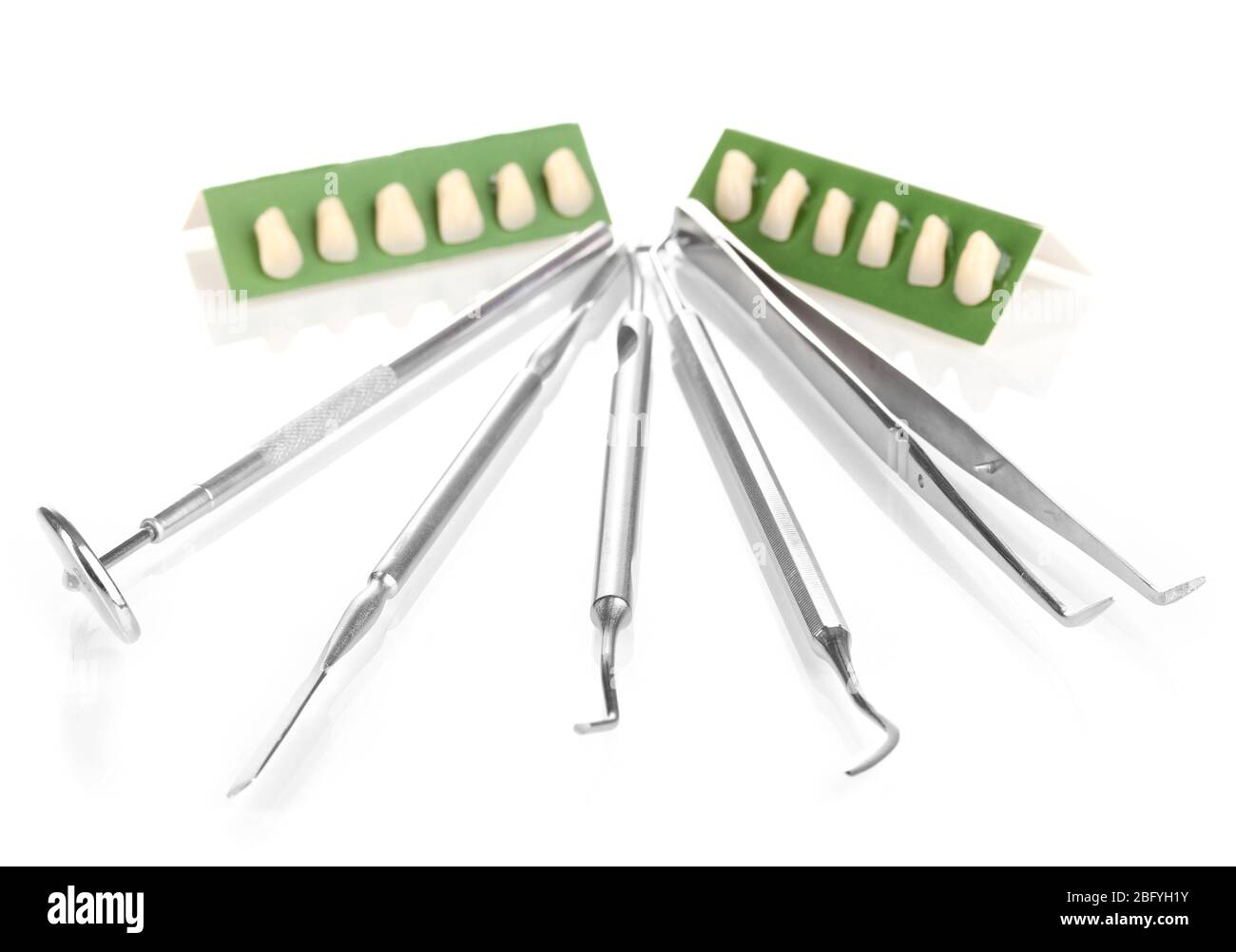 denture with dental tools isolated on white Stock Photo - Alamy