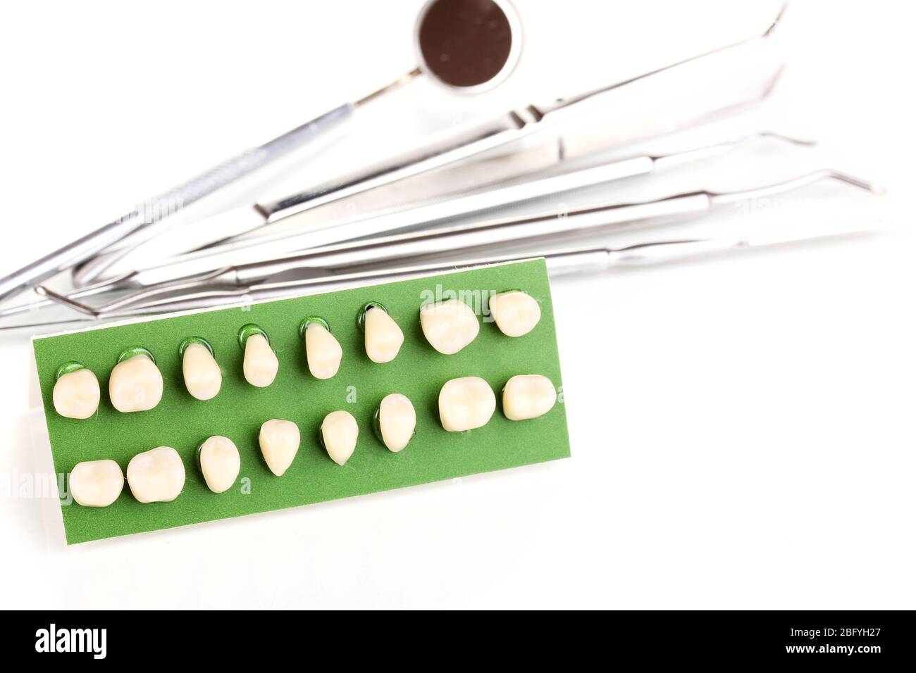 denture with dental tools isolated on white Stock Photo - Alamy