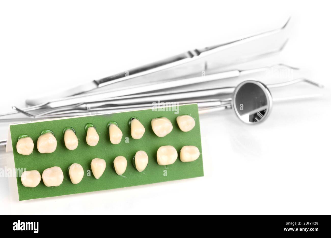 denture with dental tools isolated on white Stock Photo - Alamy