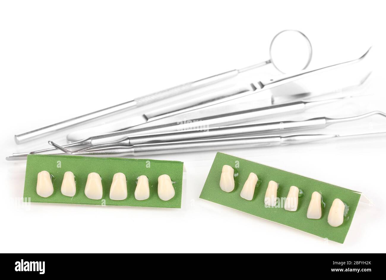 denture with dental tools isolated on white Stock Photo - Alamy