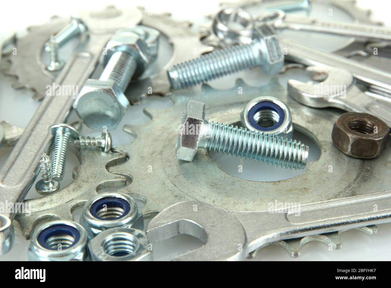 Machine gear, metal cogwheels, nuts and bolts background, close-up ...
