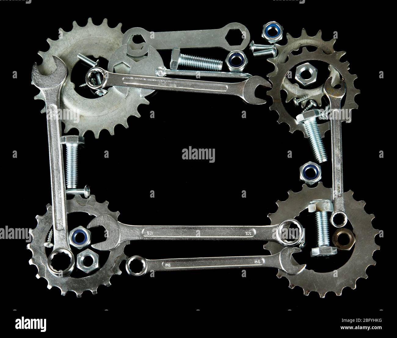 Machine gear, metal cogwheels, nuts and bolts isolated on black Stock ...