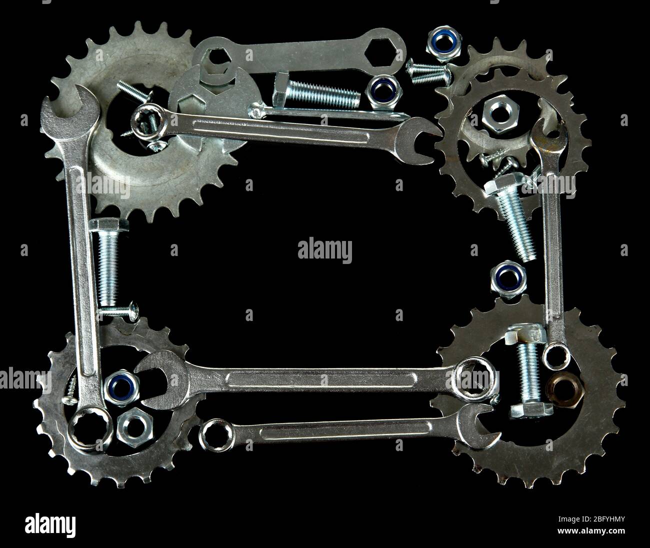 Machine gear, metal cogwheels, nuts and bolts isolated on black Stock ...