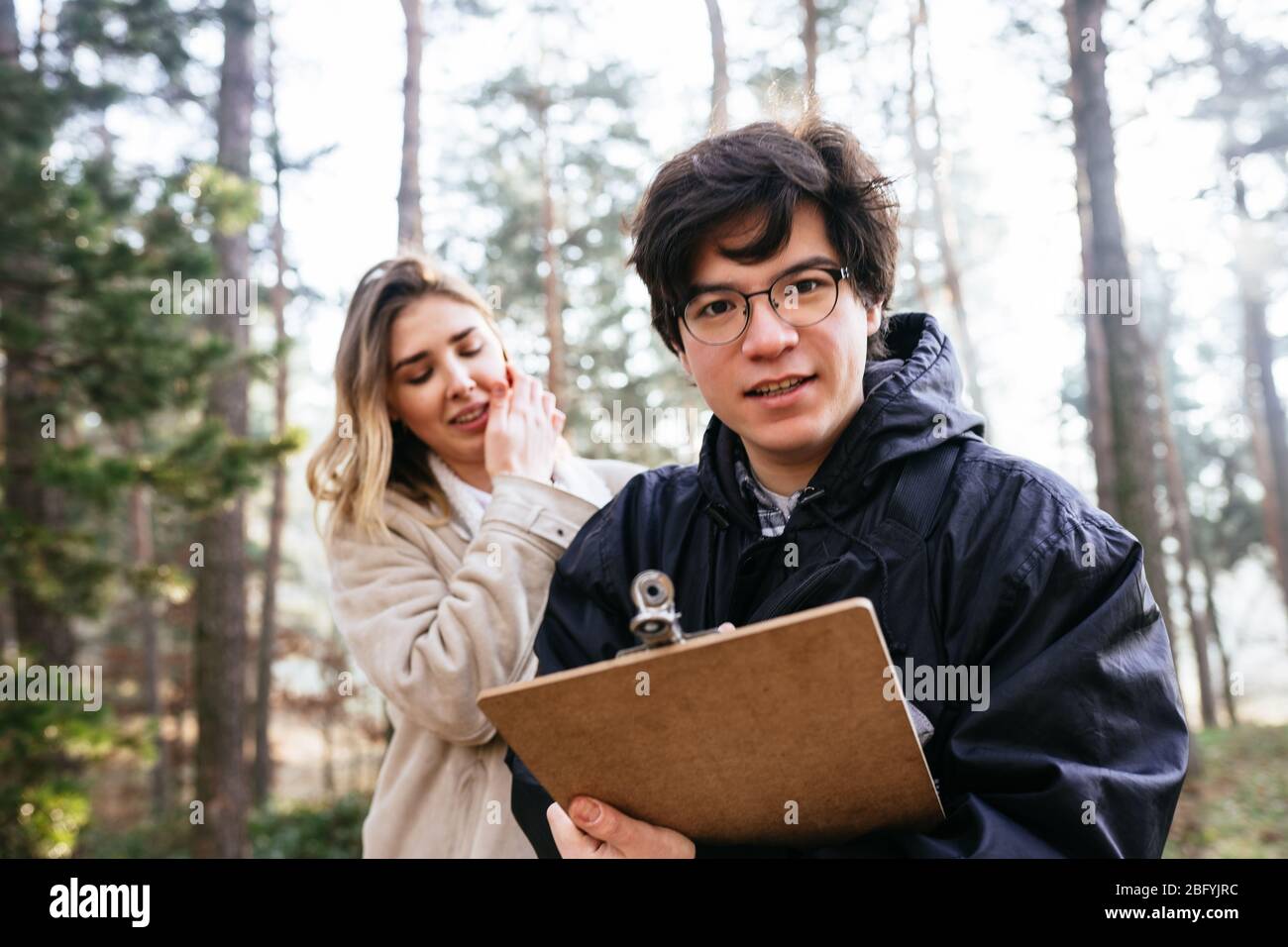 Scientists are studying plant species and inspect trees in the forest ...