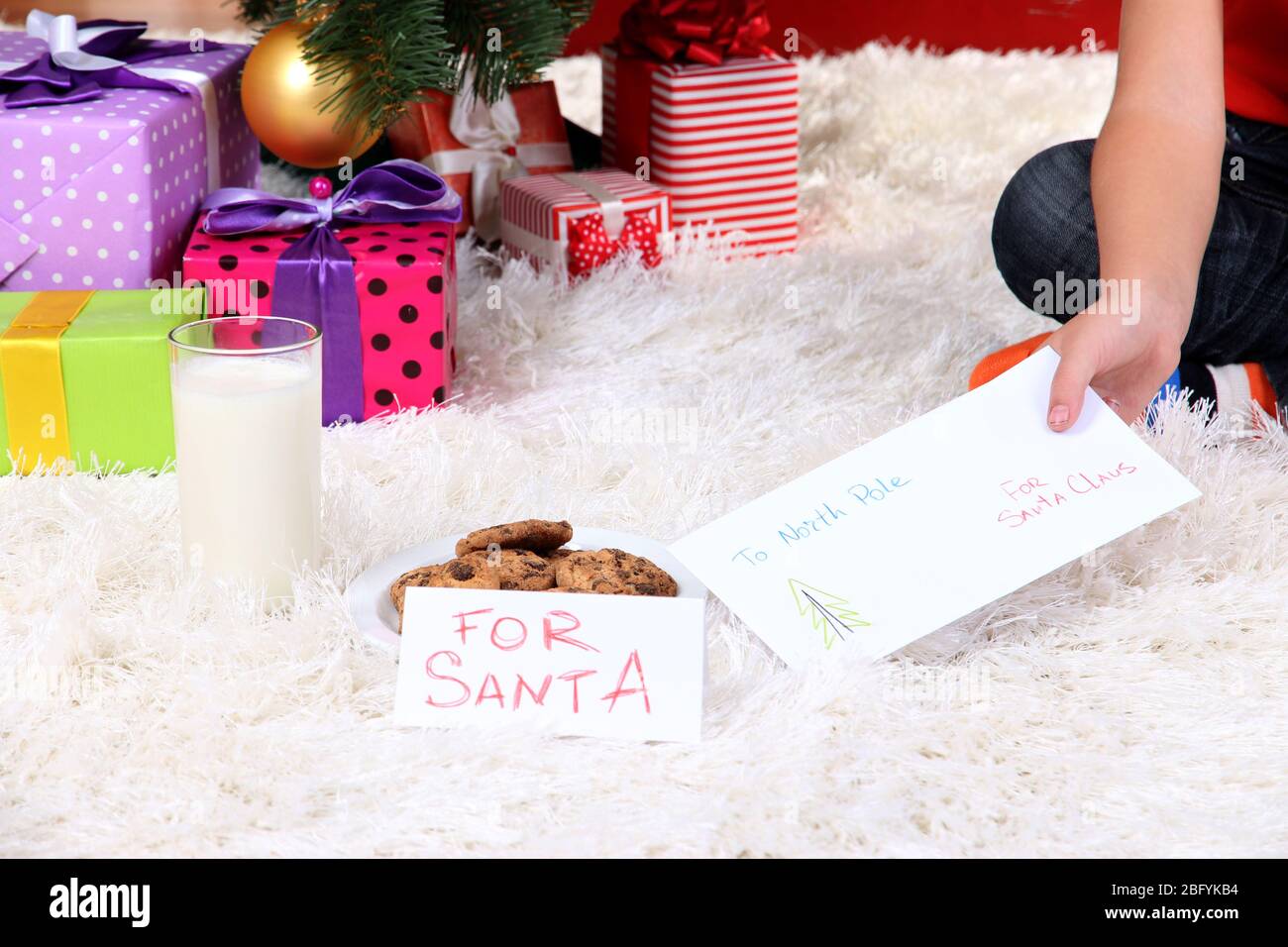 Milk, cookies and letter for Santa Claus under Christmas Tree Stock ...