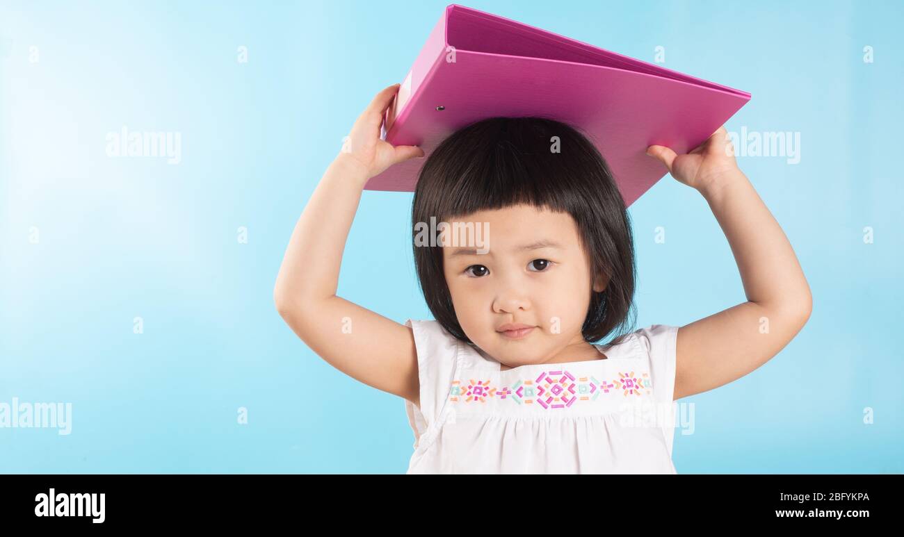 Cute Asian girls are holding a file folder showing ideas for new ideas ...