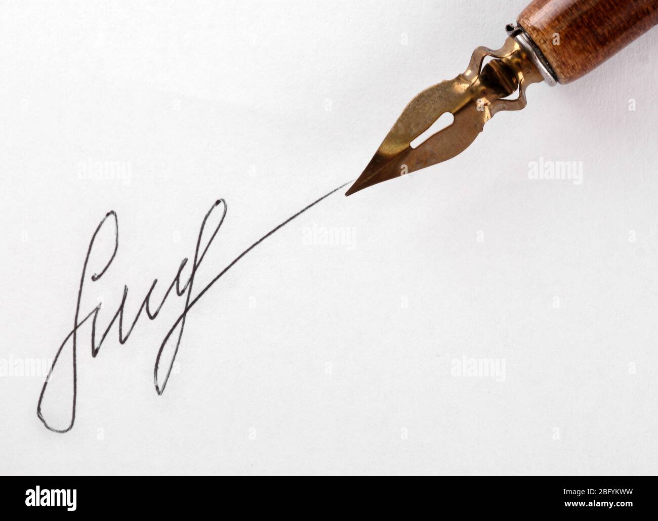 Closeup of signature (fake, not real) and ink pen, isolated on white ...
