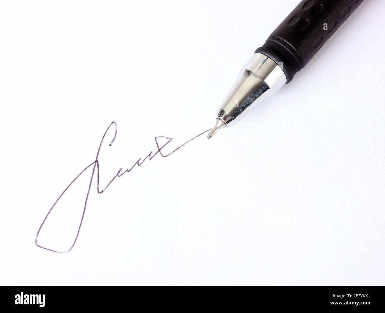 Closeup of signature (fake, not real) and pen, isolated on white Stock ...