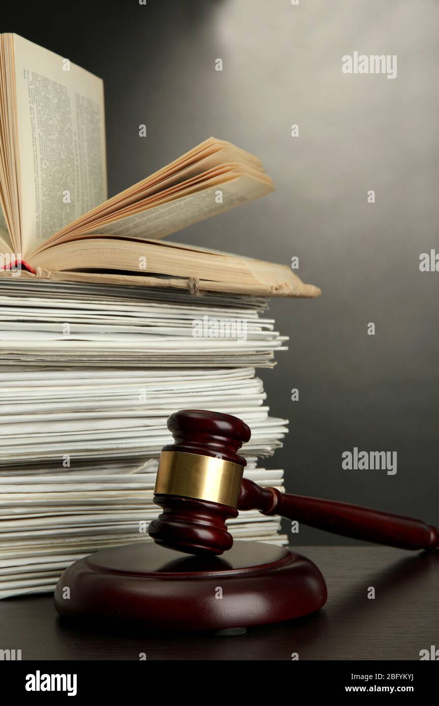 gavel and old papers on grey background Stock Photo - Alamy