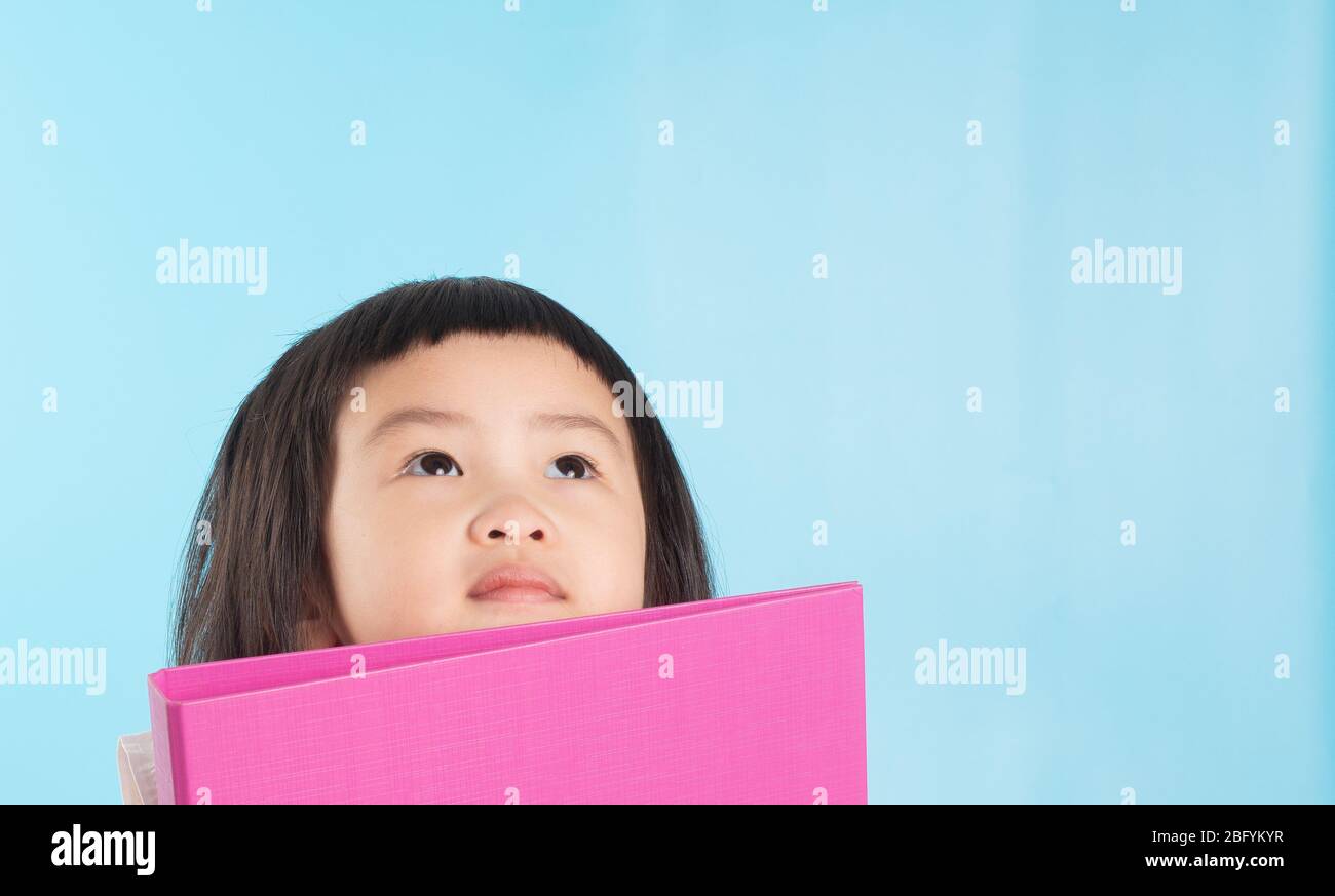 Cute Asian girls are holding a file folder showing ideas for new ideas ...