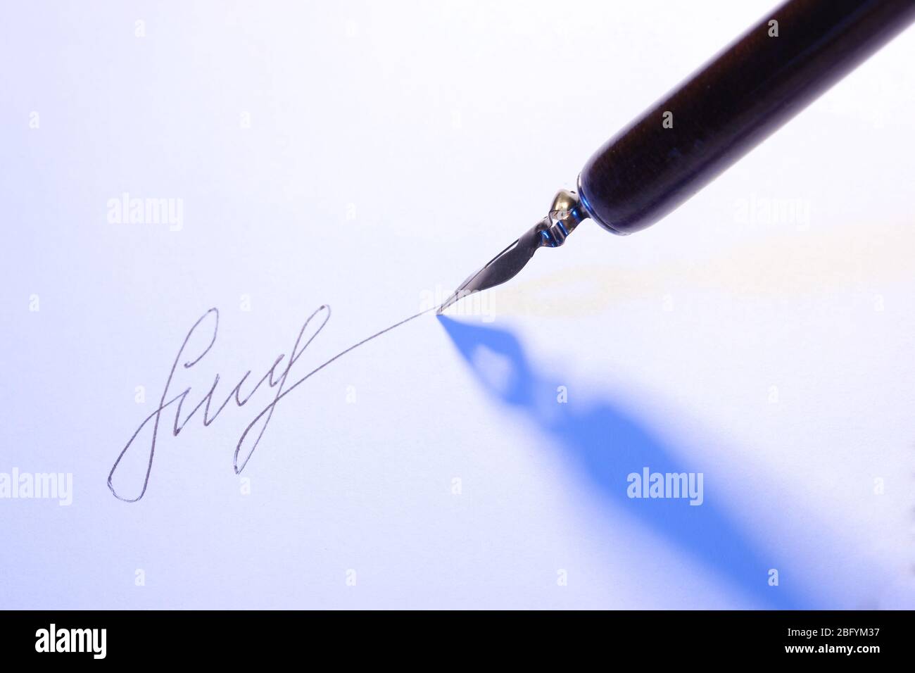 Closeup of signature (fake, not real) and ink pen, isolated on white ...