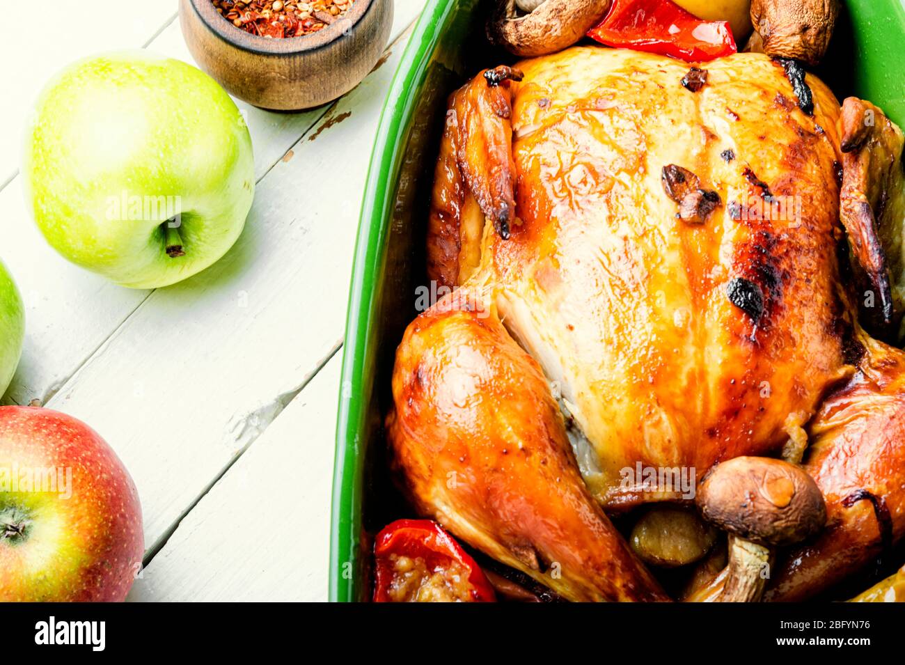 Appetizing baked chicken with apples in baking dish Stock Photo - Alamy