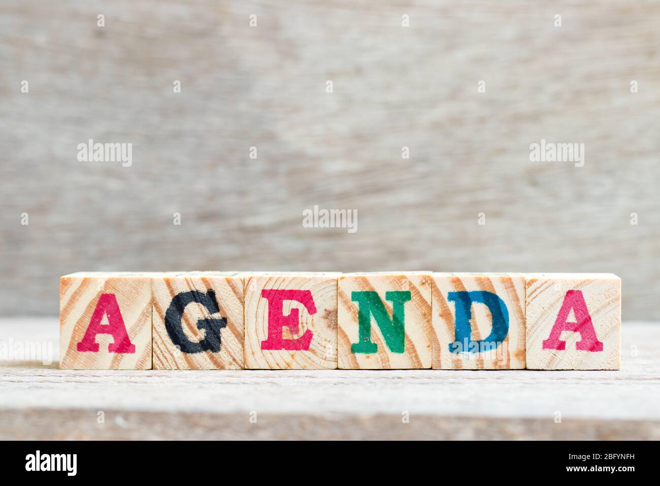 Letter block in word agenda on wood background Stock Photo - Alamy