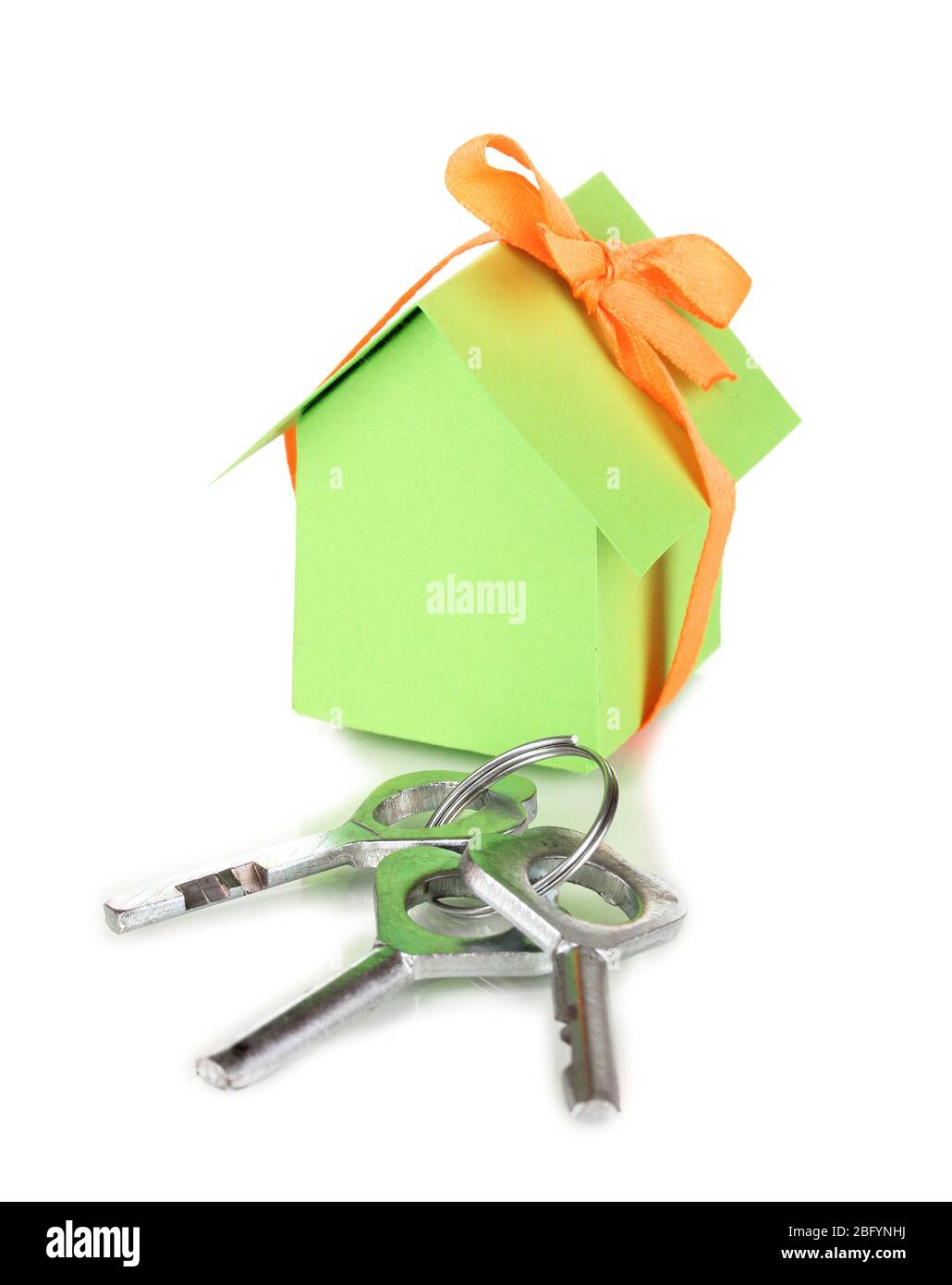 Small house with key isolated on white Stock Photo - Alamy
