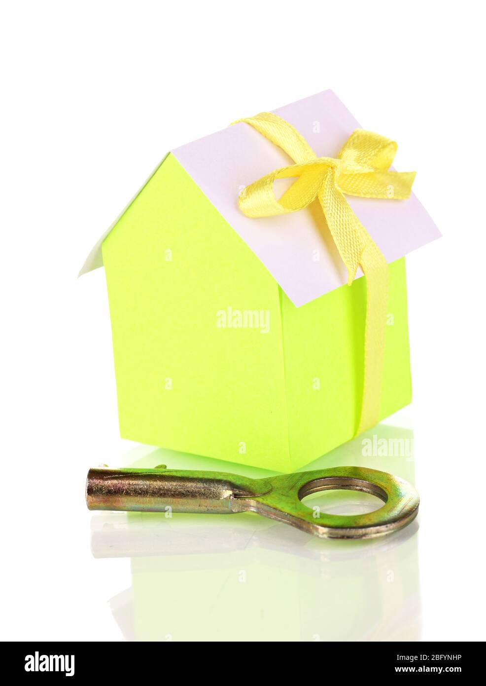 Small house with key isolated on white Stock Photo - Alamy