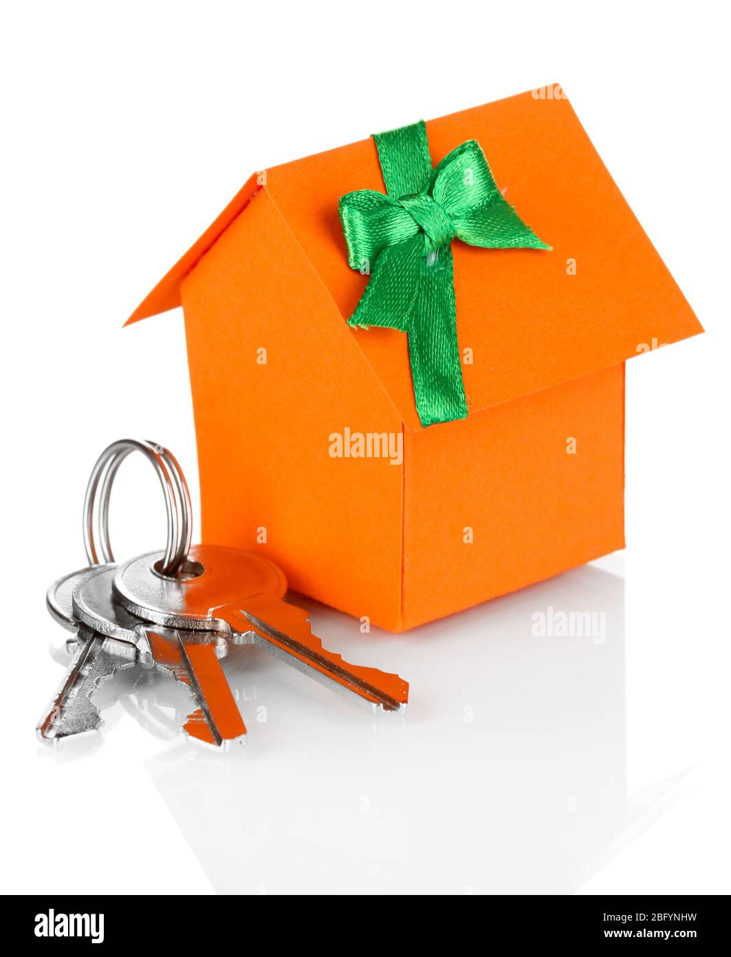 Small house with key isolated on white Stock Photo - Alamy