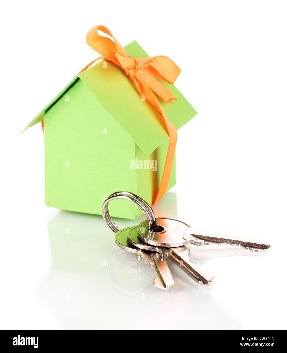 Small house with key isolated on white Stock Photo - Alamy