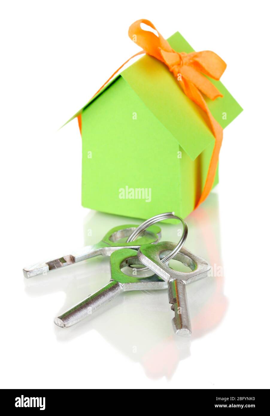 Small house with key isolated on white Stock Photo - Alamy