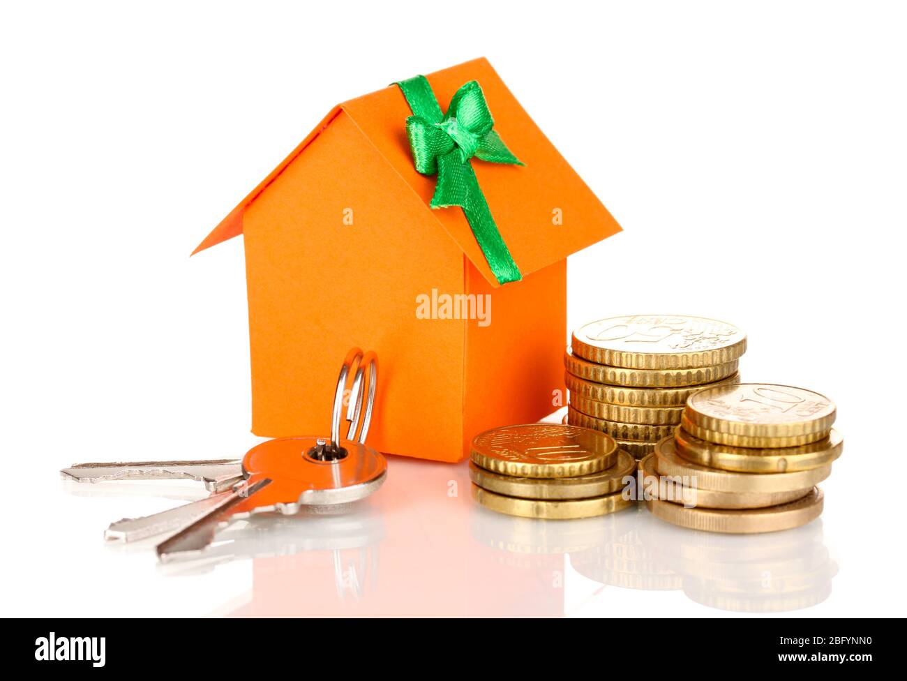 Small house with money and key isolated on white Stock Photo - Alamy
