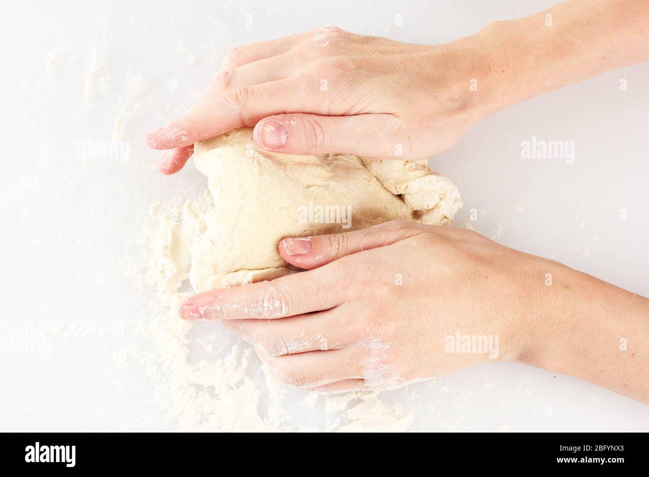 Preparing pizza dough isolated on white Stock Photo - Alamy