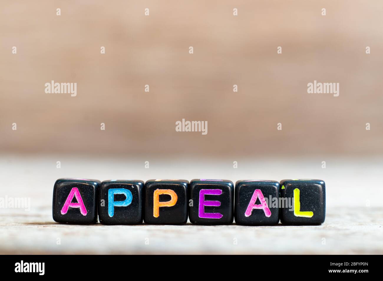 Black bead with color alphabet in word appeal on wood background Stock ...