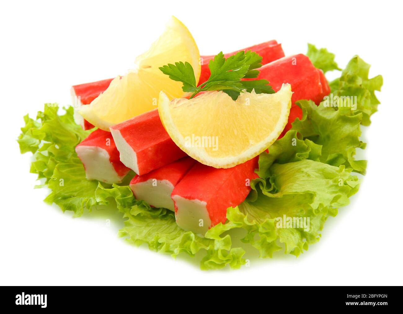 Crab sticks on lettuce leaves with lemon, isolated on white Stock Photo ...