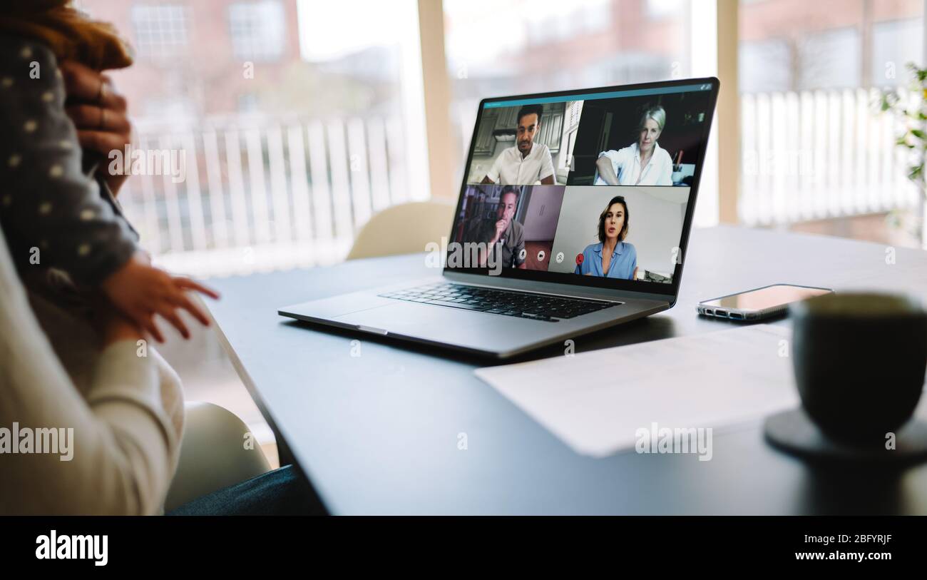 businesspeople having a video call. Woman at home using a laptop to ...