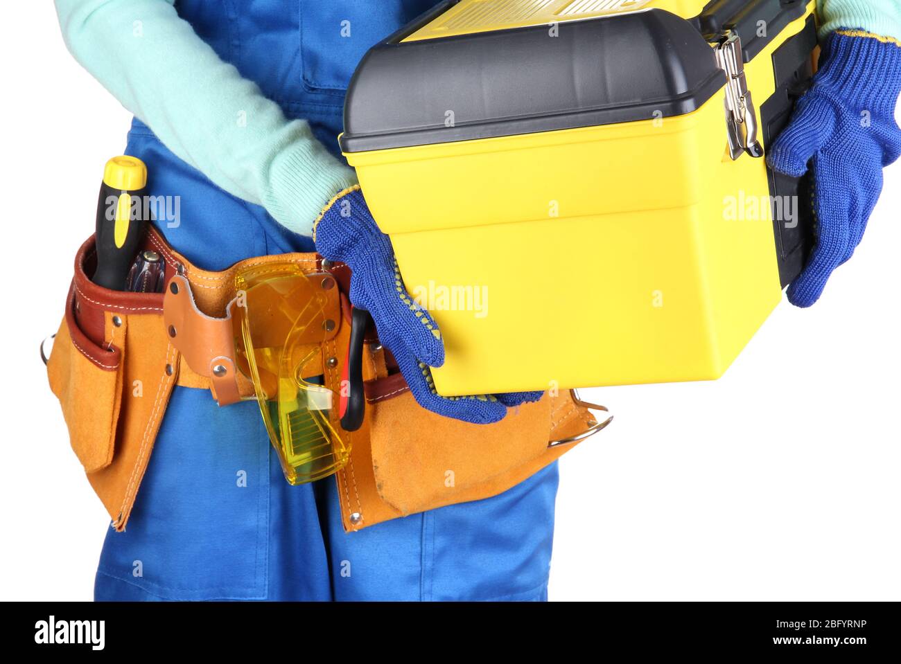 Male builder in blue overalls with yellow suitcase isolated on white ...