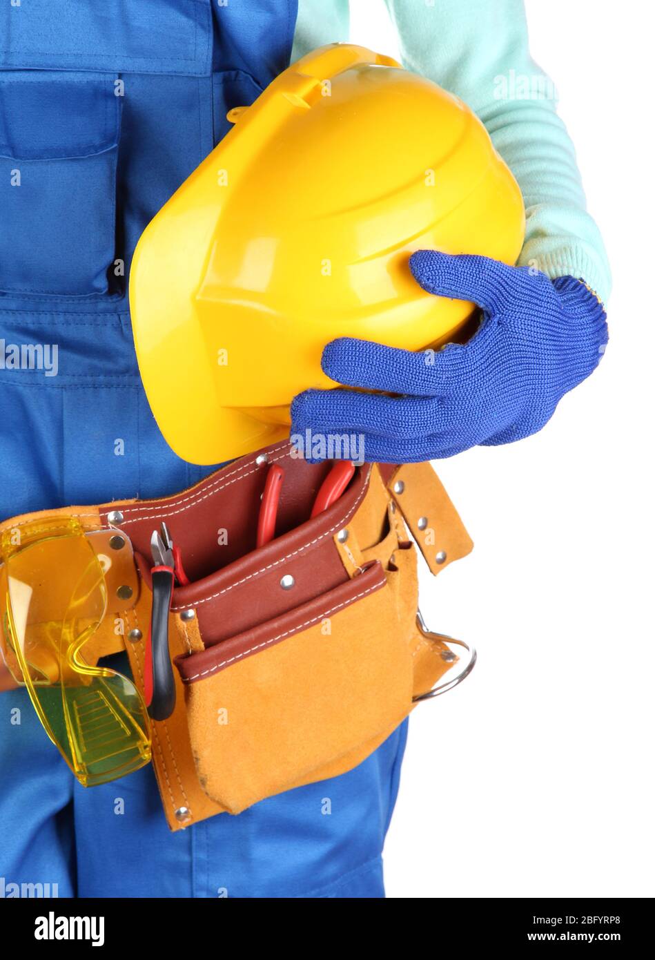 Male builder in blue overalls with yellow helmet isolated on white ...