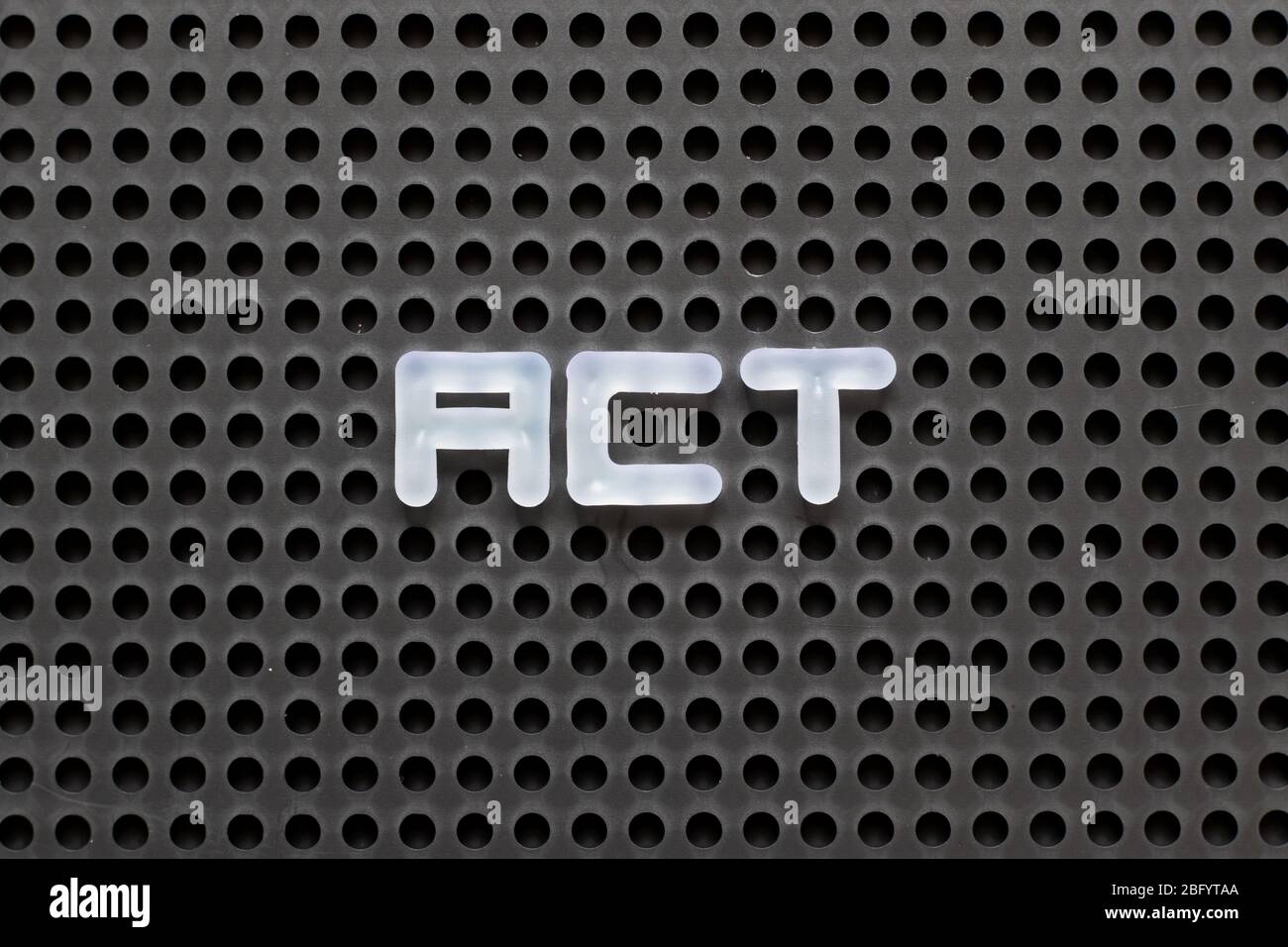 Black color pegboard with white letter in word act Stock Photo - Alamy