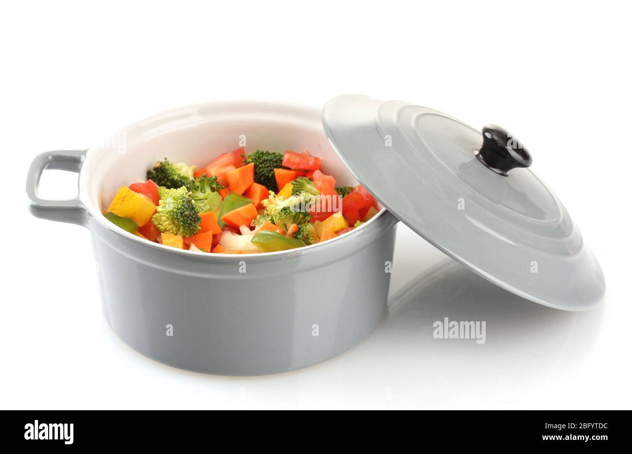 Vegetable stew in gray pot isolated on white Stock Photo - Alamy