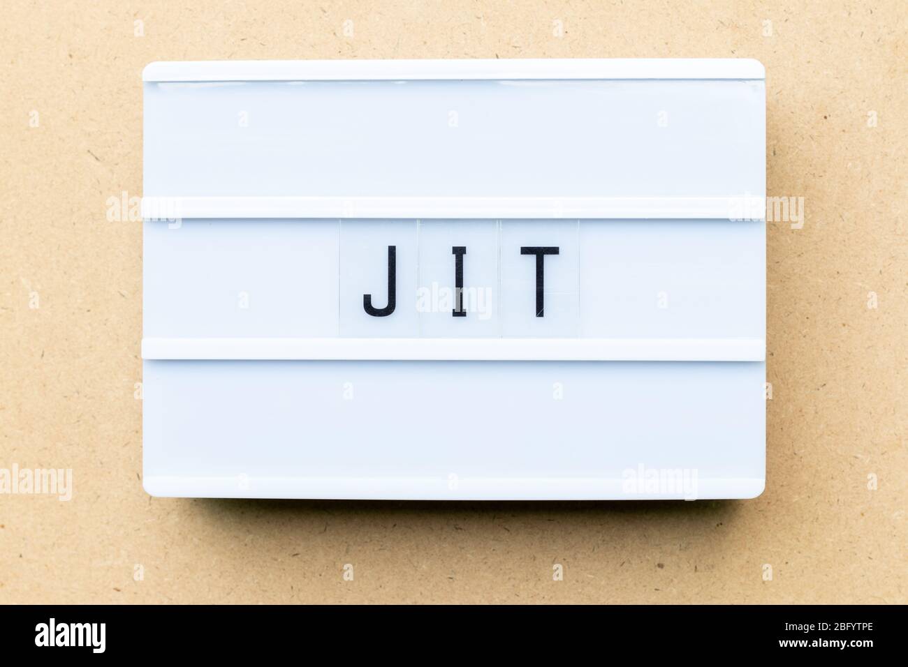 White lightbox with word JIT (abbreviation of just in time) on wood background Stock Photo - Alamy