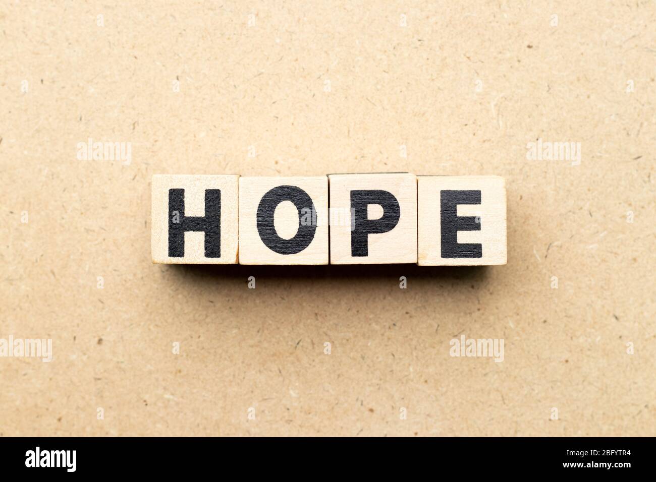 Alphabet letter block in word hope on wood background Stock Photo - Alamy