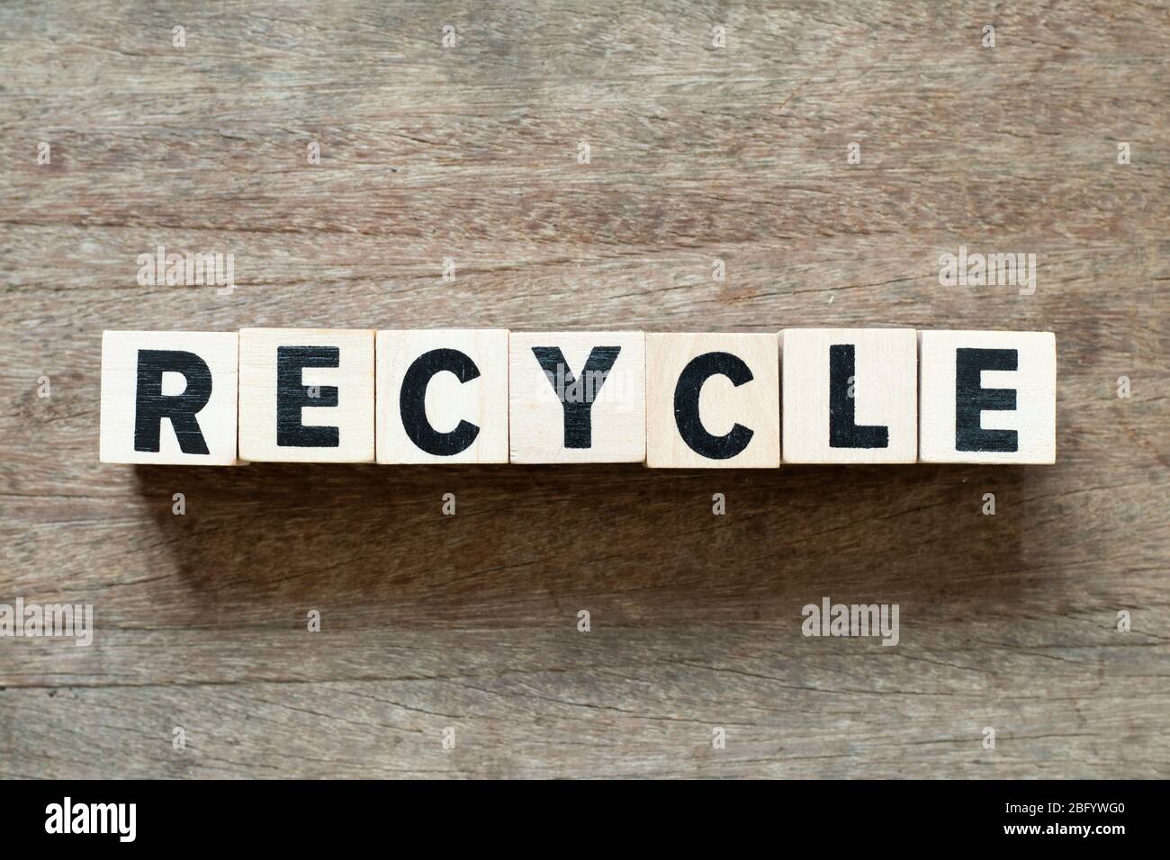 Letter block in word recycle on wood background Stock Photo - Alamy