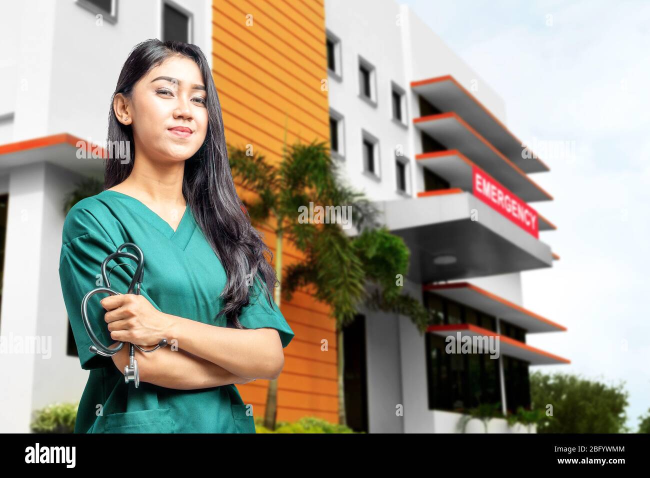 Asian Doctor woman with stethoscope standing in front of the emergency ...