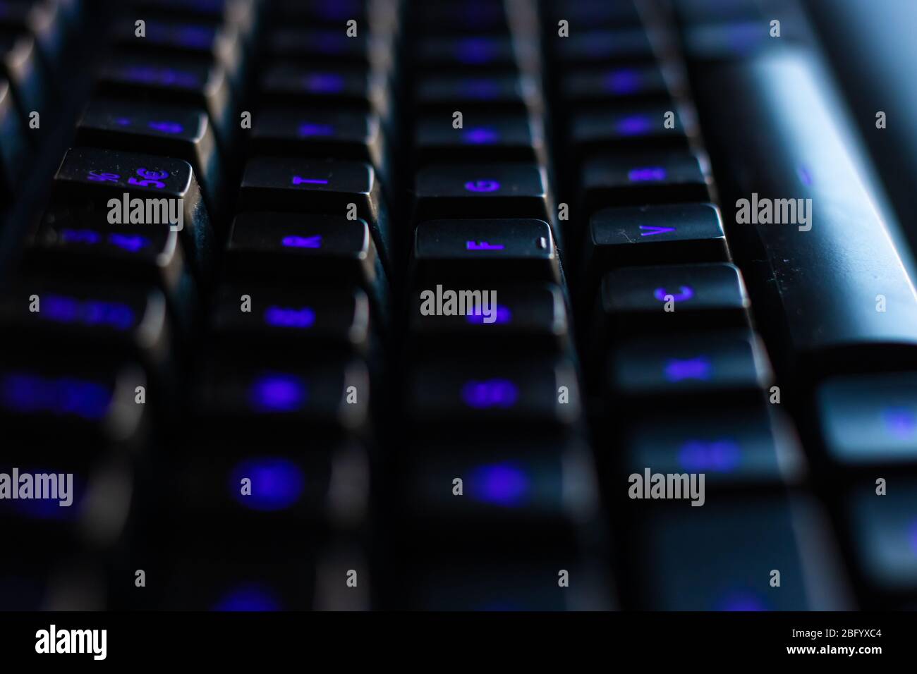the black computer keyboard with light Stock Photo - Alamy
