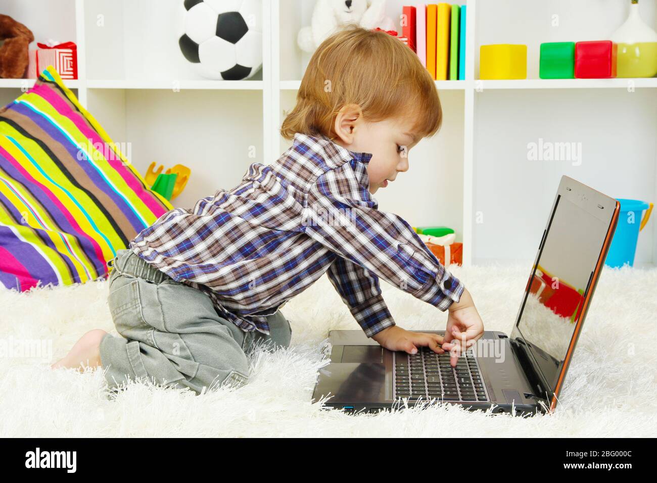 cute little boy and notebook in room Stock Photo - Alamy