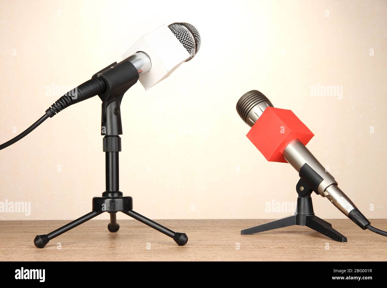 Microphone stands on meeting room table Stock Photo - Alamy